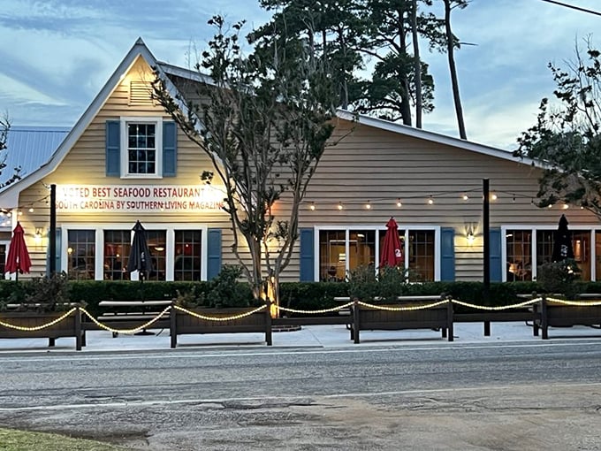 The unassuming exterior of Lee's Inlet Kitchen stands proudly with its "Best Seafood Restaurant" banner – like finding a treasure chest disguised as a tackle box.