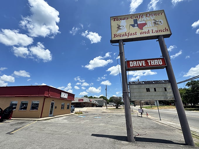 That classic roadside sign against the big Texas sky – like a beacon calling to hungry travelers and locals alike.