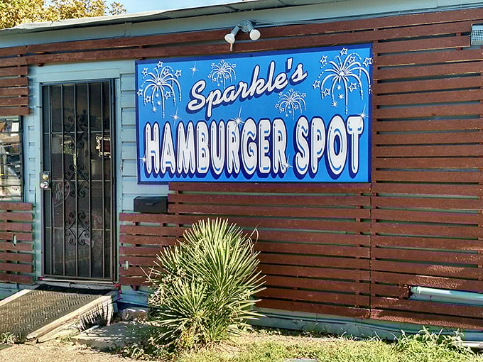 The blue sign beckons like a neon oasis in the desert of chain restaurants. Sparkle's wooden exterior promises authenticity you can't manufacture.