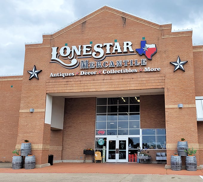 The brick facade of Lone Star Mercantile stands like a temple to Texas treasures, complete with iconic stars flanking the entrance—vintage hunting paradise awaits inside.