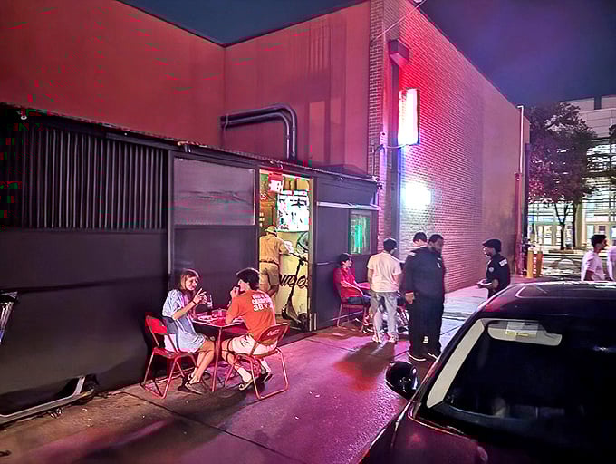 The unassuming exterior of Taqueria De Diez glows with promise at night, where patrons enjoy sidewalk dining under the warm Austin sky.