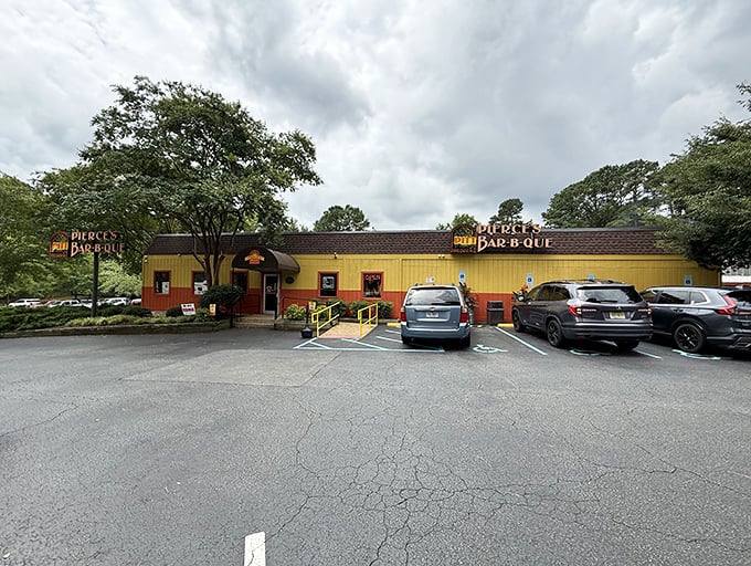 The yellow and orange exterior of Pierce's isn't just a building—it's a beacon of barbecue hope on the Williamsburg landscape.