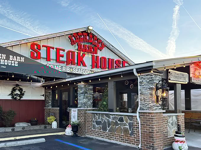 That iconic red signage isn't just announcing a restaurant—it's broadcasting a Virginia Beach institution where memories are served alongside prime cuts.