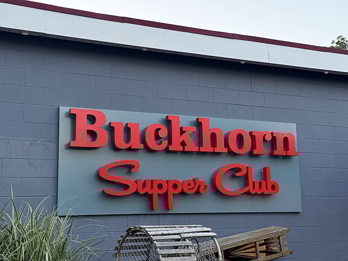 The iconic red signage of Buckhorn Supper Club stands out against the gray exterior, with lobster traps hinting at the treasures waiting inside.