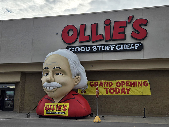 The smiling mascot outside Ollie's isn't just welcoming shoppers—it's practically announcing "your wallet is about to have a very good day!"