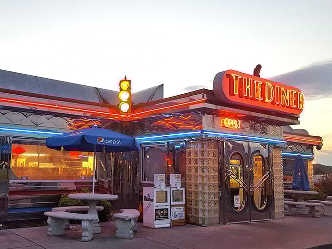 That neon glow isn't just a sign—it's a beacon of hope for hungry travelers seeking refuge from chain restaurant mediocrity.