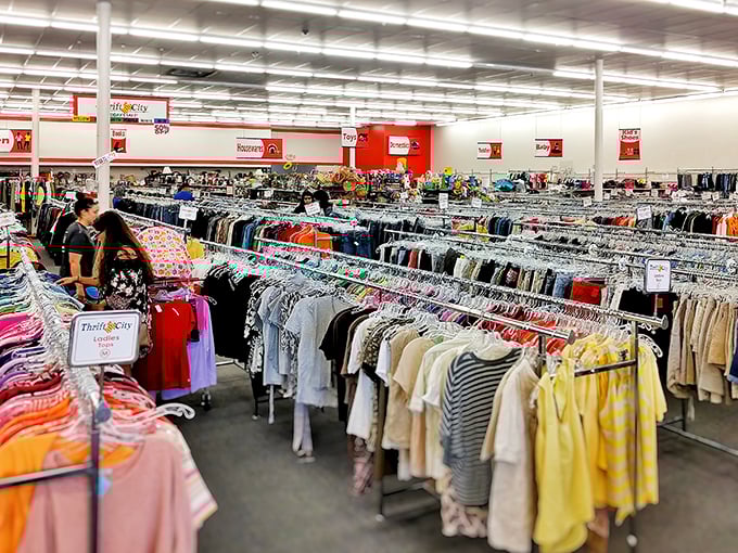 The women's section is organized with military precision. Color-coded racks make finding that perfect blouse easier than locating Texas on a map.