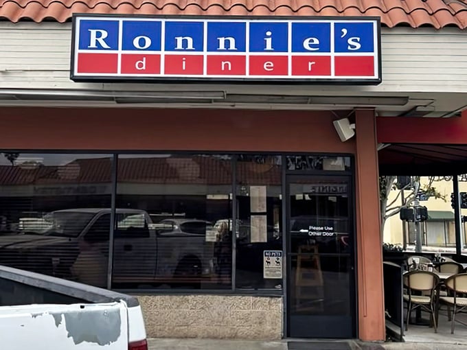 The unassuming blue and red sign promises no frills, just honest food – like finding a secret handshake in culinary form.