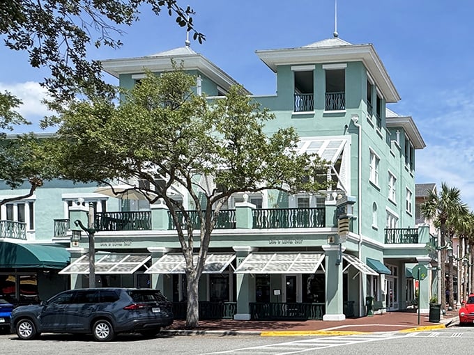 The mint-green façade of Downtown Diner stands like a tropical oasis in Celebration, promising breakfast dreams come true beneath Florida's endless blue sky.