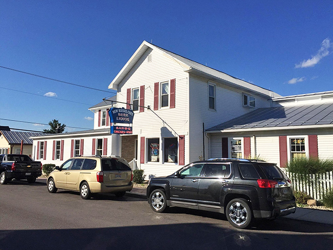 The classic white clapboard exterior of New Riegel Cafe stands like a time capsule in rural Ohio, complete with vintage striped awnings that have sheltered hungry visitors for generations.