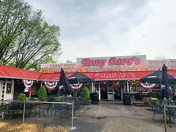 The iconic red roof and welcoming facade of Tony Gore's promises smoky delights within. "Never trust a skinny cook" isn't just a slogan—it's barbecue philosophy.