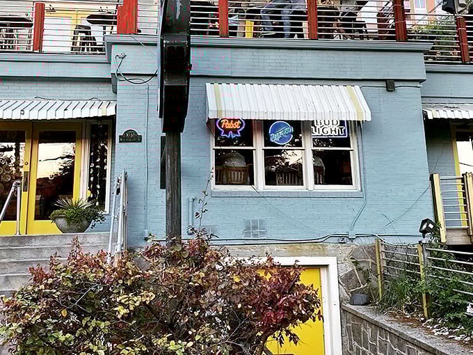 The light blue exterior with cheerful yellow accents feels like a coastal secret hiding in plain sight in Atlanta's urban landscape.