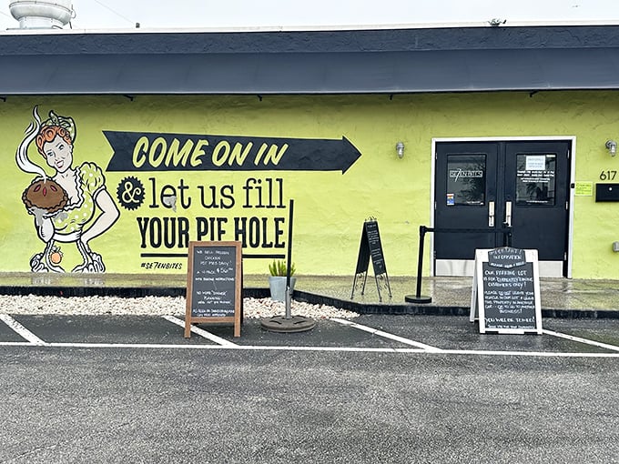 The bright yellow exterior with its cheeky "let us fill your pie hole" mural isn't just inviting—it's practically daring you to come inside.