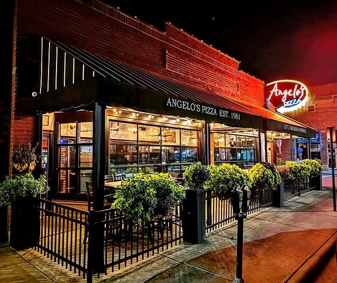 The brick facade of Angelo's Pizza in Lakewood beckons like an old friend. That neon sign promises comfort and satisfaction just steps away.