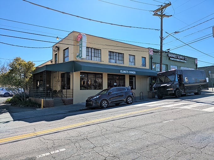 The unassuming exterior of Elmo's Diner stands like a beacon of breakfast hope on Durham's Ninth Street, promising comfort food salvation inside.