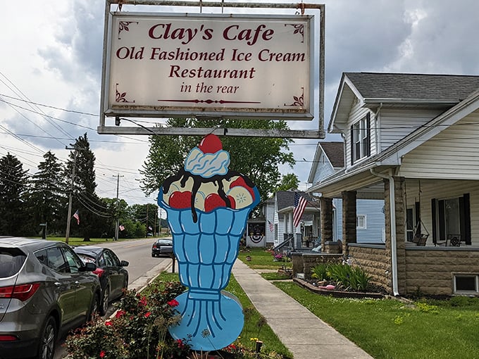 The sign says it all – old-fashioned ice cream and comfort food await behind that giant blue sundae sculpture. Small-town America at its most delicious.