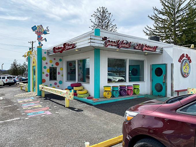 The Poky Dot's exterior is like a cartoon come to life—colorful tire seats, turquoise accents, and a promise of "good food from old friends" that feels genuinely sincere. 