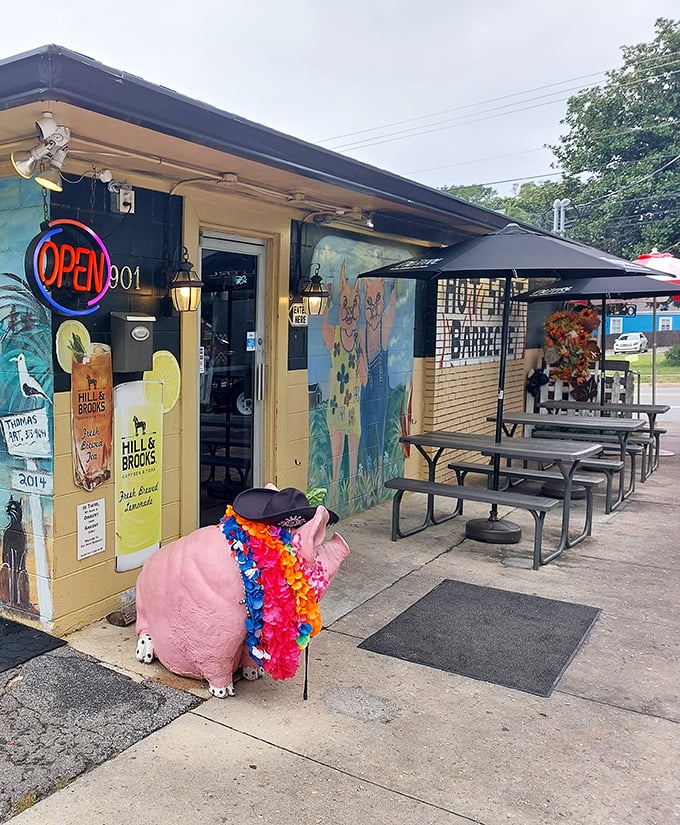 The pink pig with a Hawaiian lei isn't just decoration—it's your first clue that Hot Spot Barbecue takes fun as seriously as their smoking techniques.