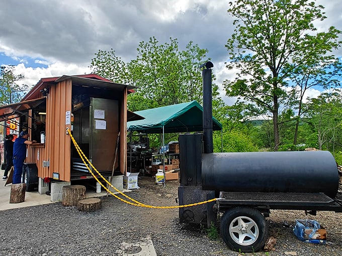 The flame-wrapped food truck announces its presence like a barbecue beacon. No fancy signage needed when the aroma does all the talking.