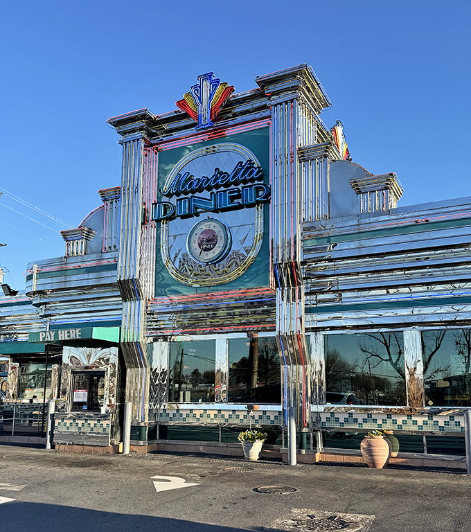 Sunlight dances across the diner's Art Deco façade, its neon sign promising the kind of meal that makes you want to hug the chef afterward.