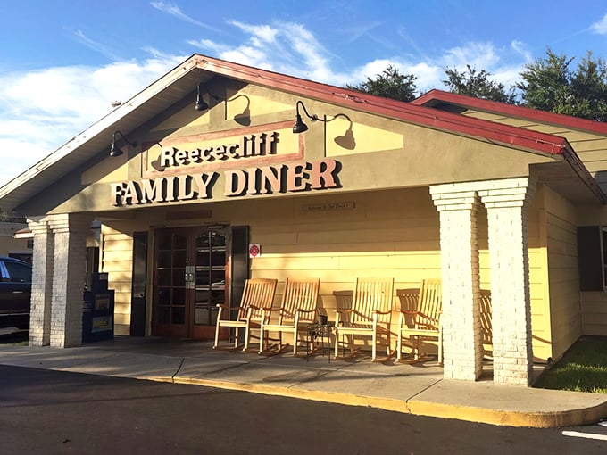 Those wooden rocking chairs aren't just for show—they're where locals patiently wait their turn for a taste of Florida's breakfast royalty.