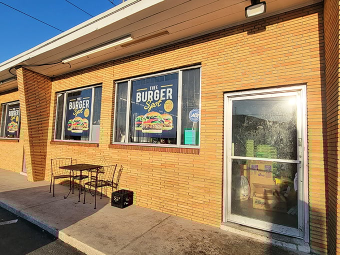 The golden-bricked exterior of Thee Burger Spot beckons like a temple of comfort food, promising affordable deliciousness behind its unassuming façade.