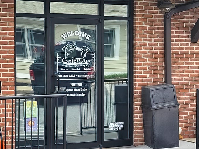 The unassuming entrance to barbecue paradise. Behind this glass door, smoke-kissed treasures await the hungry traveler.