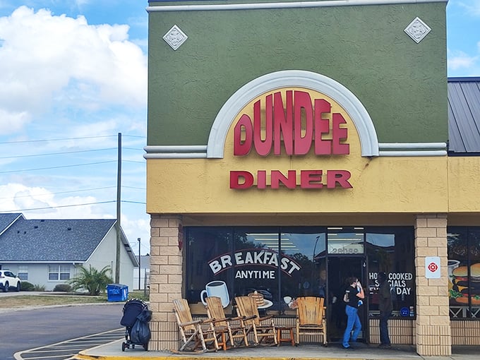 The green and yellow facade of Dundee Diner beckons with its promise of "Breakfast Anytime" and those wooden rocking chairs—Florida's version of a velvet rope line.