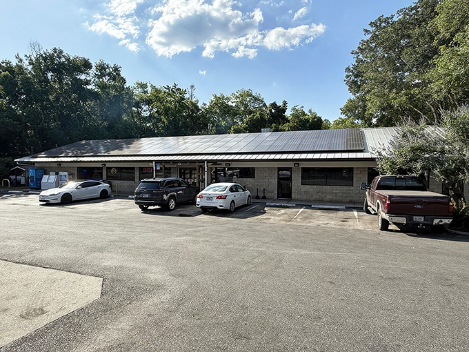 The unassuming exterior of Pearl's promises what fancy restaurants rarely deliver—authentic flavor without the fuss. Those blue benches have heard decades of post-meal satisfaction sighs.