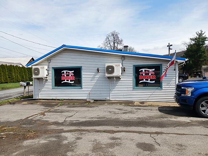 The classic red and white lattice exterior of Peg & Bill's isn't trying to be retro-cool—it's the real deal, a genuine roadside treasure in Cogan Station.