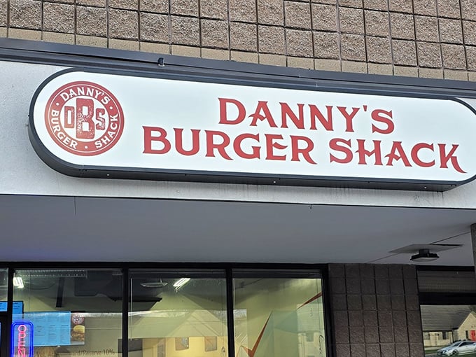 The unassuming storefront of Danny's Burger Shack stands like a beacon of hope for burger enthusiasts – no fancy frills, just a promise of greatness within.