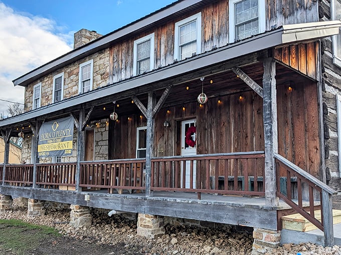 The wraparound porch whispers promises of country charm before you even taste what's cooking inside.
