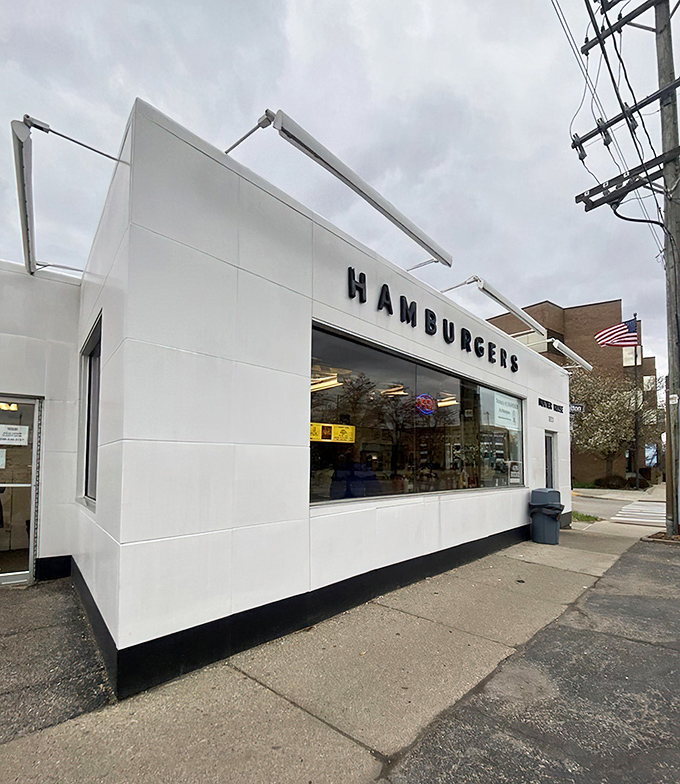 The gleaming white exterior of Hunter House stands like a time capsule on Birmingham's streets—a burger beacon that's been drawing devotees for generations.