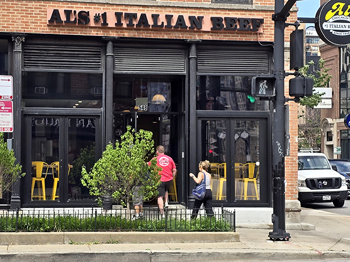 The unassuming storefront on Wells Street hides Chicago's beef royalty behind those sleek black frames and bright yellow chairs – like finding the Hope Diamond in your sock drawer.