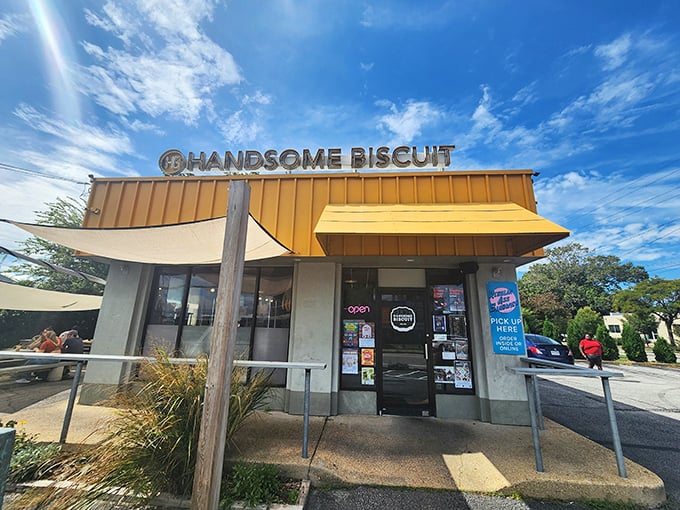 The bright yellow awning of Handsome Biscuit stands out like a beacon of hope for the hungry. This unassuming Norfolk treasure promises carb-laden salvation inside.
