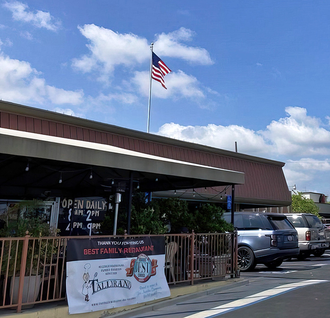 The burgundy facade of Tallyrand stands proudly under California skies, an unassuming temple to breakfast that's been drawing locals for generations.