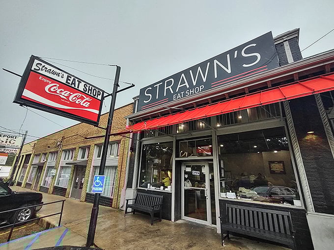 The unassuming exterior of Strawn's Eat Shop, with its vintage Coca-Cola sign, promises the kind of authentic experience that food travel shows hunt for.