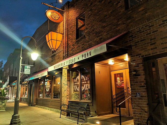 The brick façade of Union Woodshop stands proudly on Clarkston's Main Street, its red awnings like welcome flags beckoning hungry travelers to barbecue paradise.