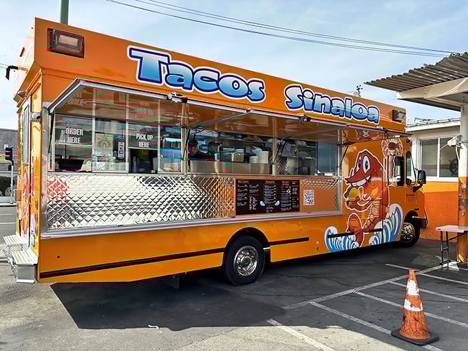Like a culinary lighthouse in Oakland's Fruitvale district, this vibrant orange truck stands ready to rescue you from mundane meals with its legendary al pastor.
