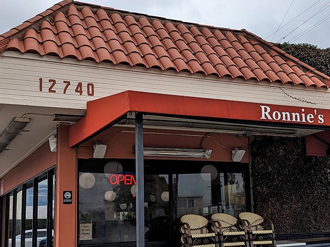The Spanish-tiled roof and coral-colored awning of Ronnie's isn't trying to impress anyone—and that's precisely why it does.