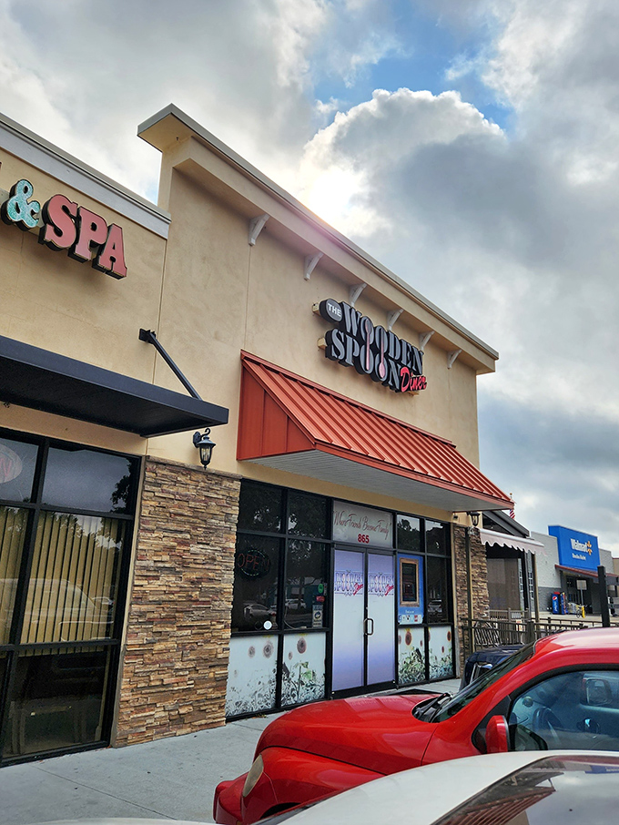That distinctive red awning and stone facade might not scream "food paradise," but locals know this Brandon storefront houses morning magic worth seeking out.