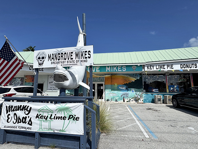 The vibrant exterior of Mangrove Mike's welcomes you with a mural that's pure Florida Keys—where breakfast dreams and underwater scenes collide in technicolor splendor.