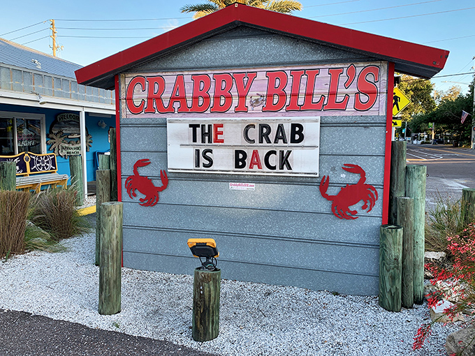 The iconic red-roofed sign at Crabby Bill's announces "THE CRAB IS BACK" – as if these delicious crustaceans ever left this Florida seafood haven.