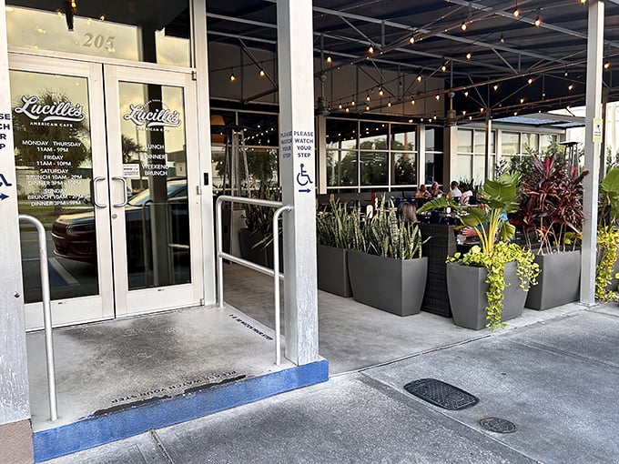 The entrance of Lucille's glows like a beacon against the sunset sky, promising comfort food salvation for hungry Winter Haven souls.