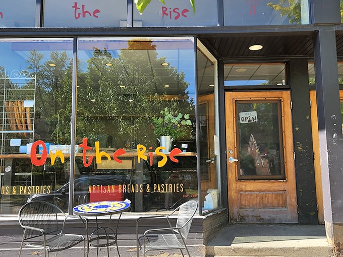 The colorful, playful lettering of "On the Rise" promises whimsy inside, while those bistro tables whisper, "Stay awhile, carb-lover."