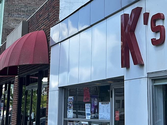 The iconic white facade with bold red "K's" lettering isn't trying to impress anyone—it doesn't need to. This unassuming storefront has been stopping traffic in Troy for decades.