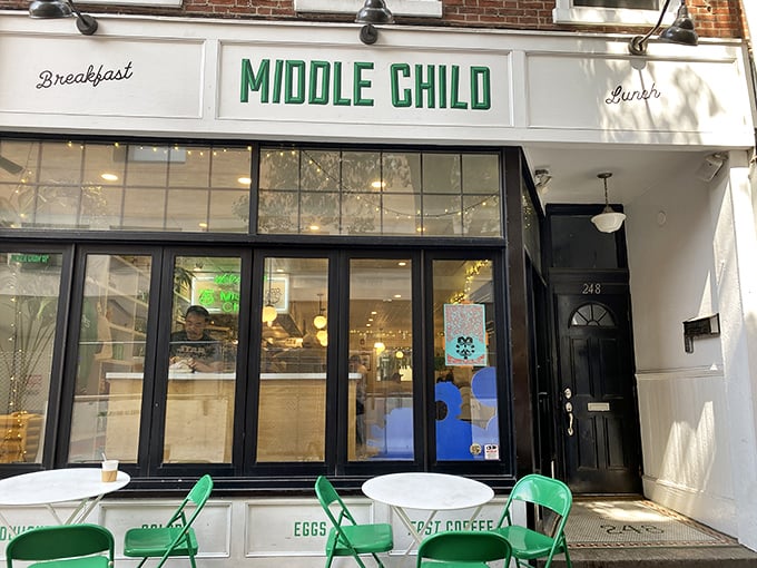 The charming storefront of Middle Child beckons with its crisp white facade and bold green lettering—Philadelphia's sandwich paradise hiding in plain sight.