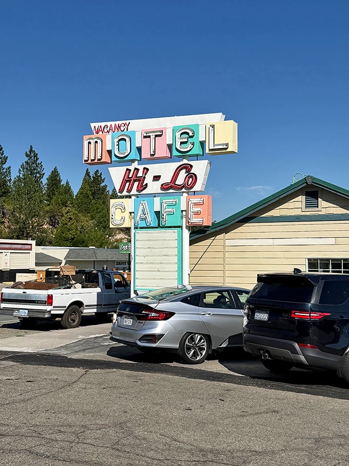 That vintage neon sign isn't just retro-cool—it's a legitimate time machine to when roadside cafés were the backbone of American highway culture. Pure nostalgic perfection.