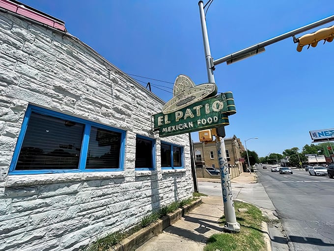 The iconic white stone exterior and vintage neon sign of El Patio stand as a beacon of Tex-Mex tradition on Guadalupe Street. Austin's culinary time machine awaits.