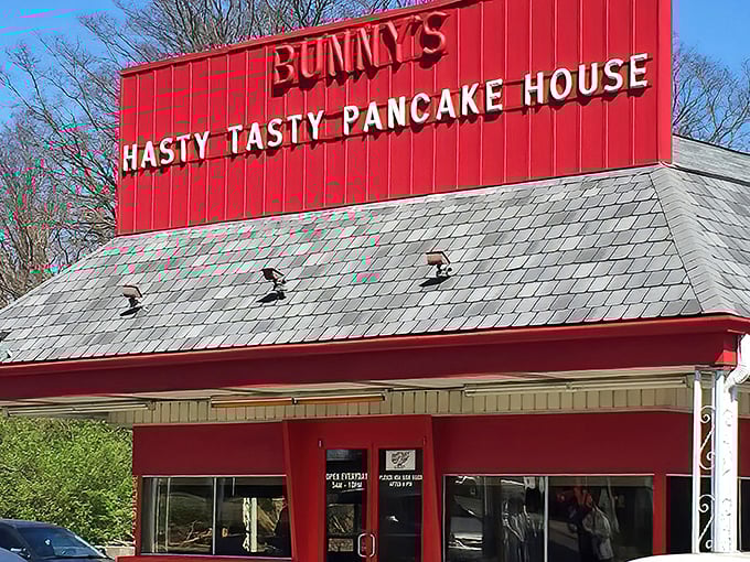 The bright red roof of Bunny's Hasty Tasty stands out like a breakfast lighthouse guiding hungry souls to pancake paradise.